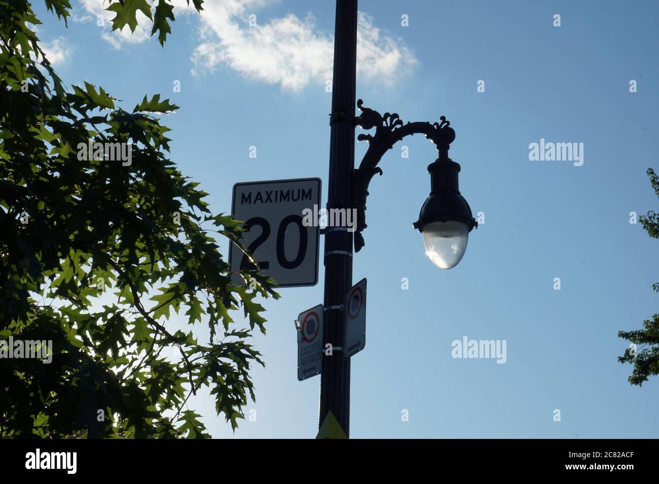 A traffic sign speed limit of 20 Km/hr in a sector with a background of ...