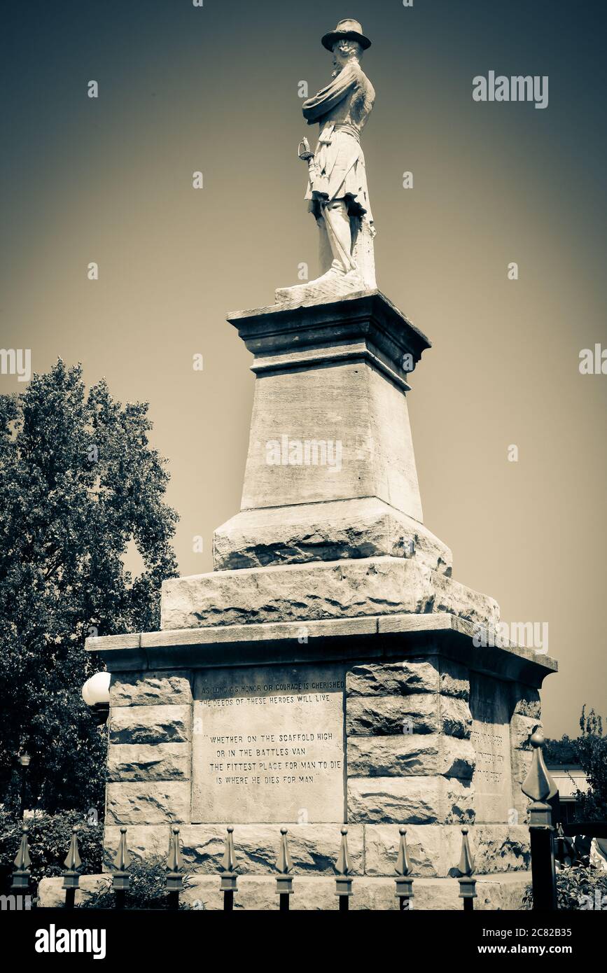 Rear side view of Confederate General Hatton statue on stone plinth ...