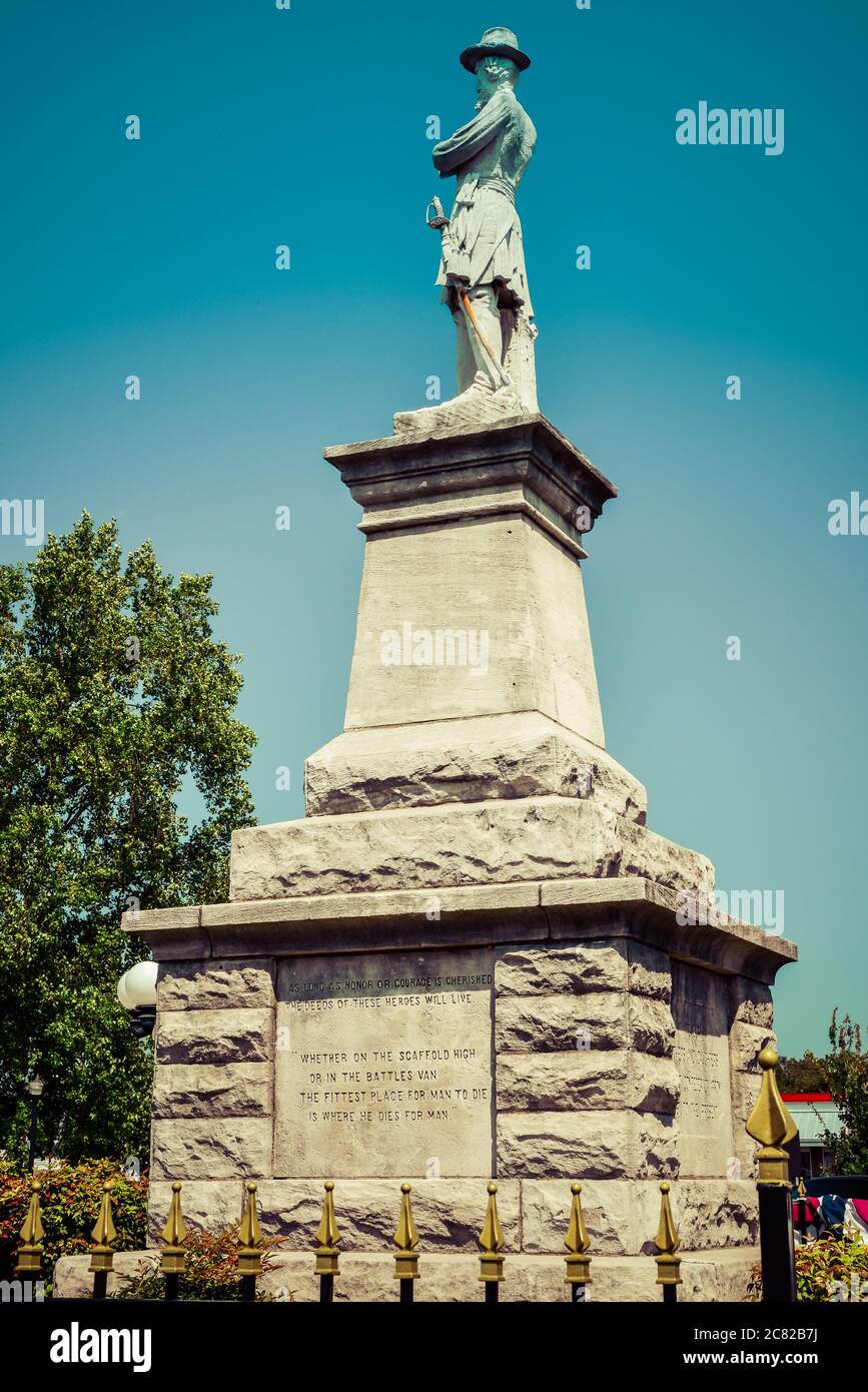 Rear side view of Confederate General Hatton statue on stone plinth ...