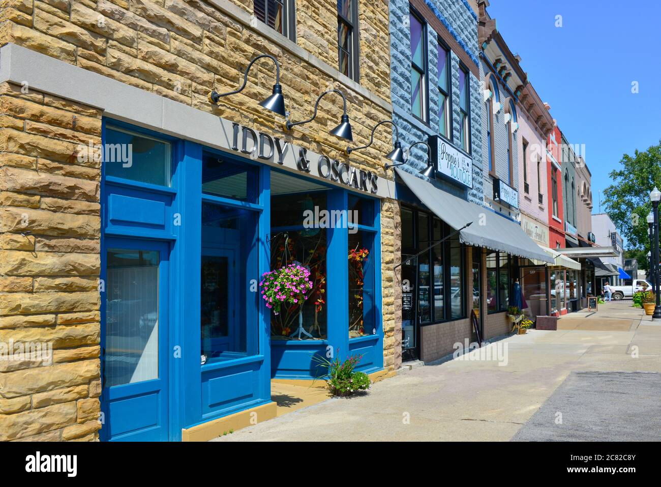 Old renovated stone and brick buildings with trendy shops in downtown ...