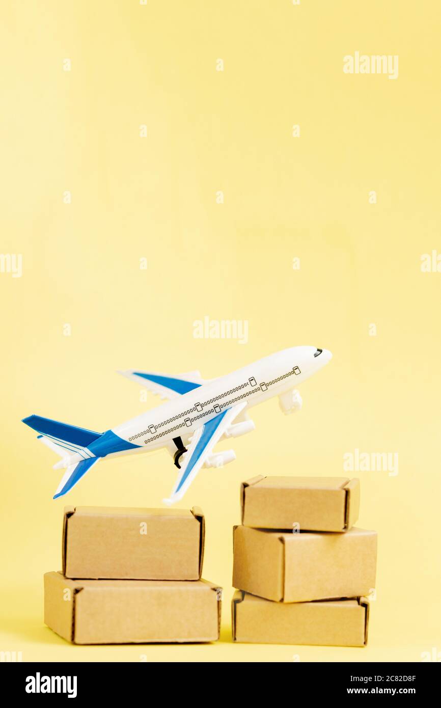 Airplane and stack of cardboard boxes. concept of air cargo and parcels ...