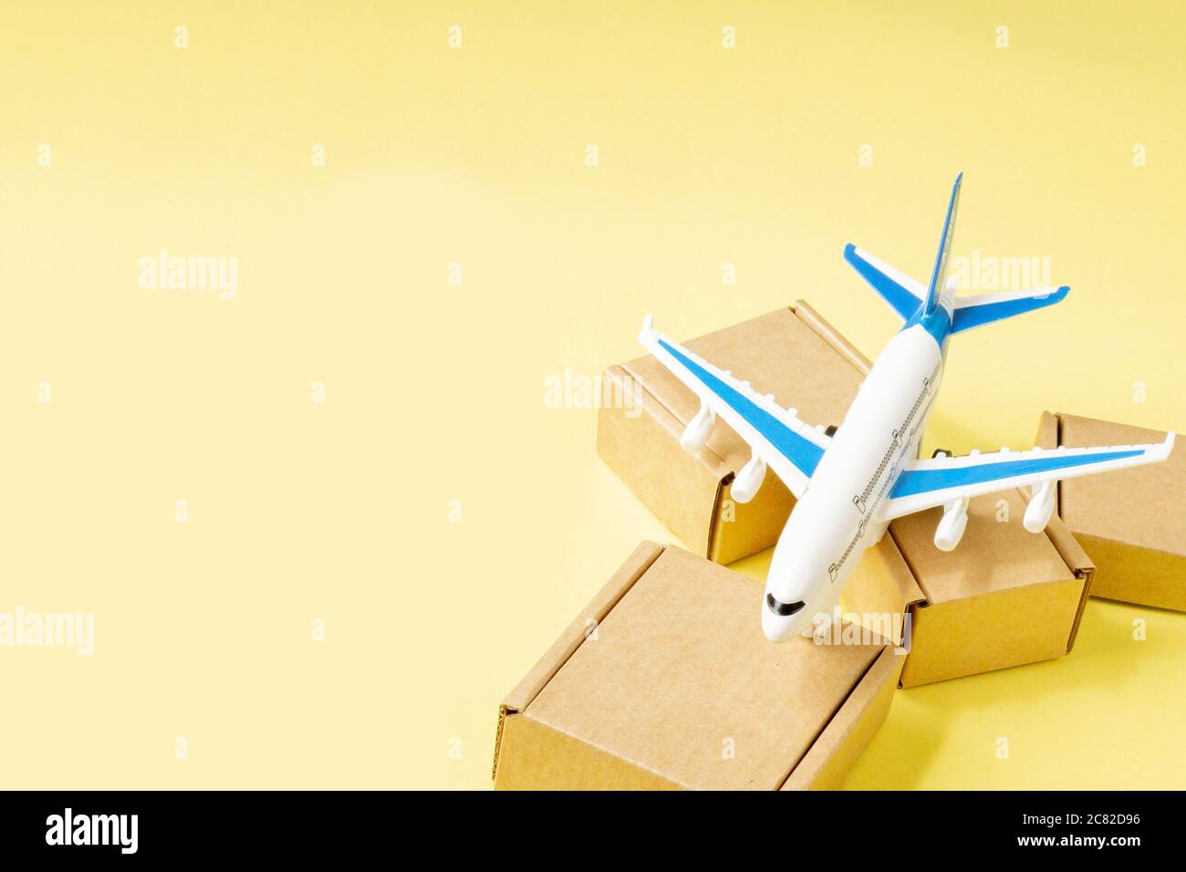 Airplane and stack of cardboard boxes. concept of air cargo and parcels ...