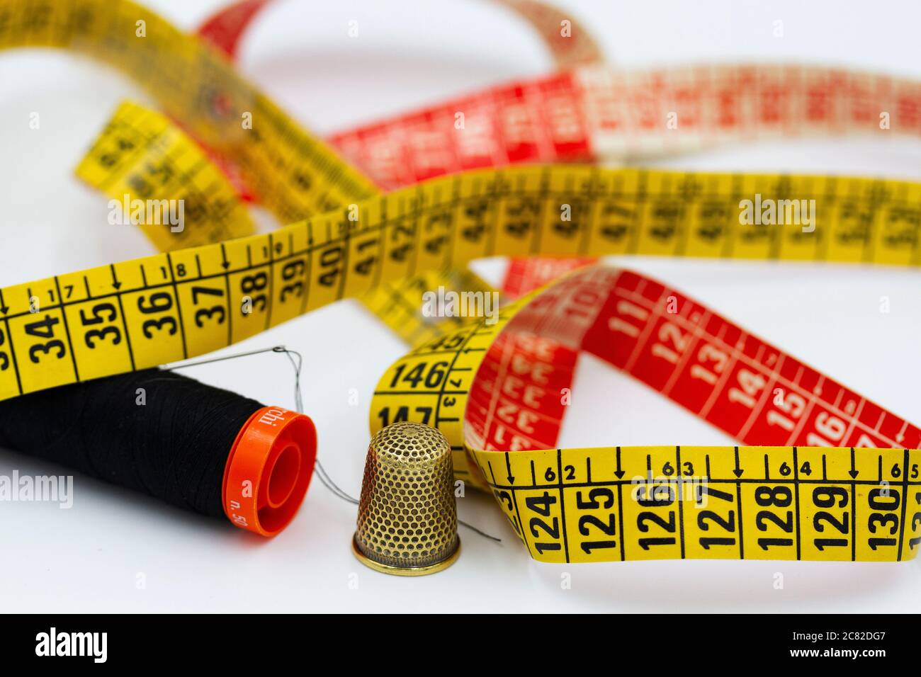 needle and thread on a white background Stock Photo - Alamy