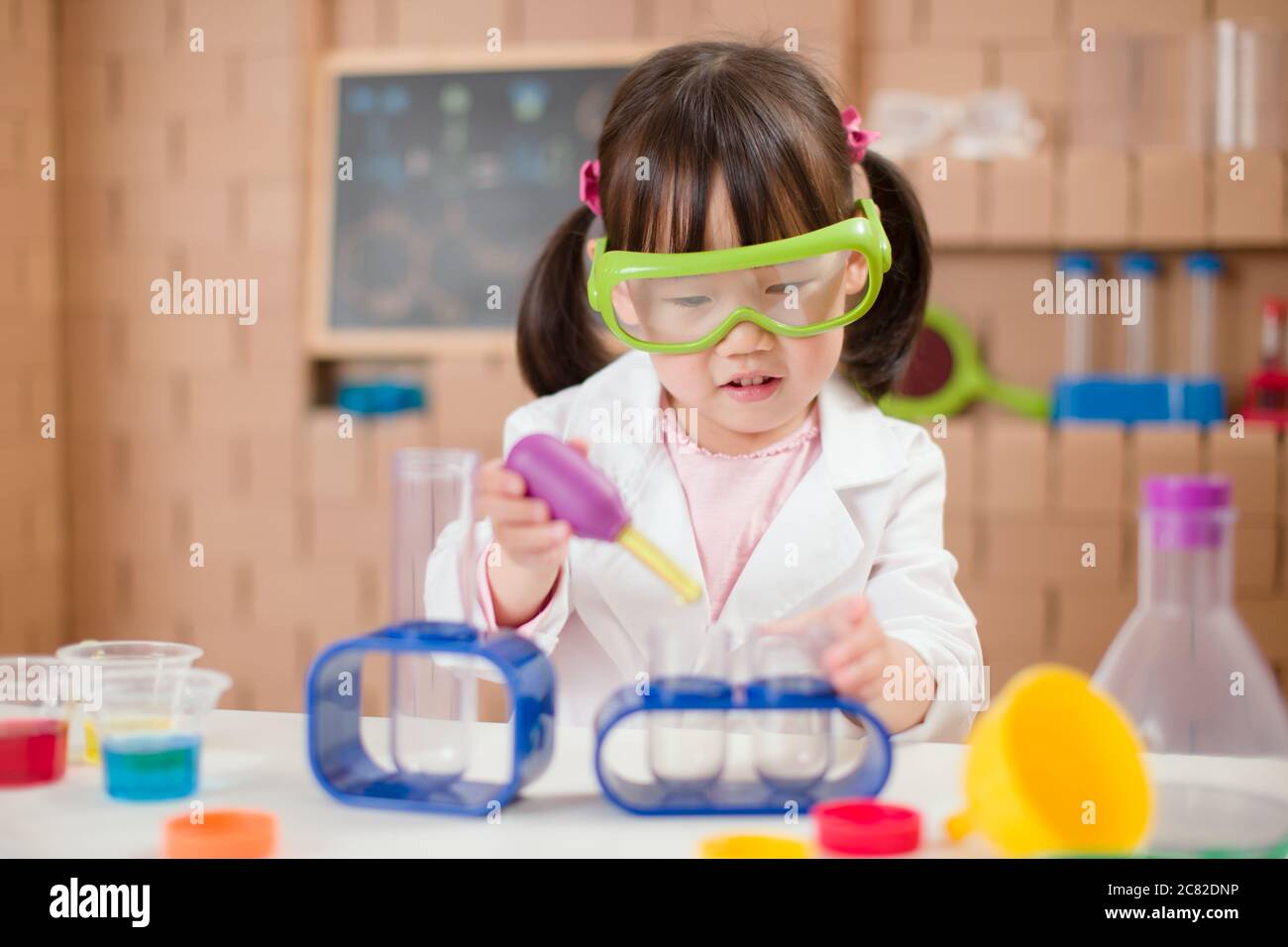 toddler girl play science experiments for homeschooling Stock Photo - Alamy