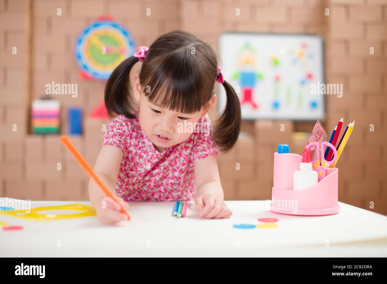 toddler girl practice drawing different shapes for homeschooling Stock ...