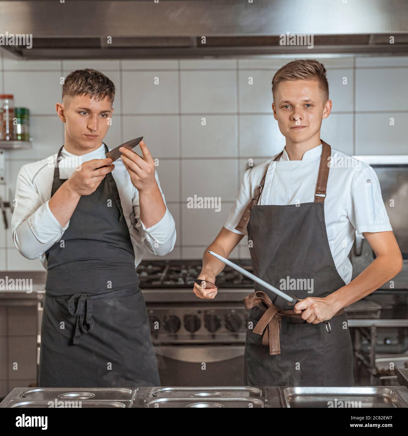 Professional chef man sharpening knife hi-res stock photography and ...