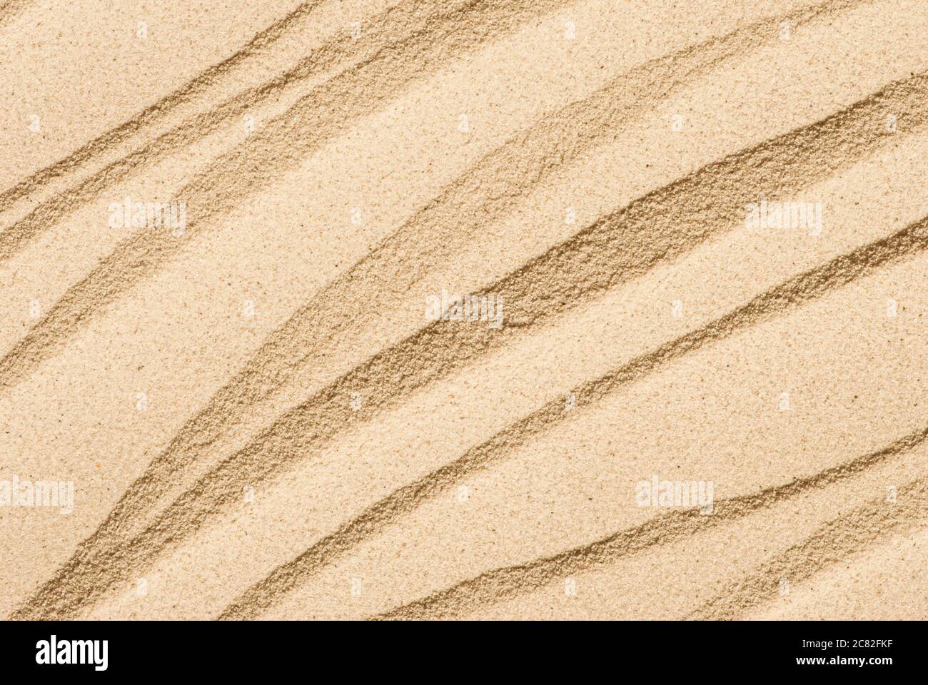 Diagonal lines and texture on sand Stock Photo - Alamy