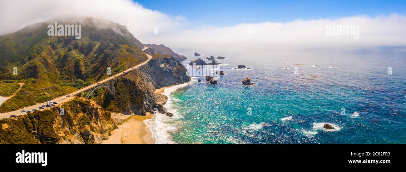 Aerial panoramic shot of an island seashore with a sea on the side ...
