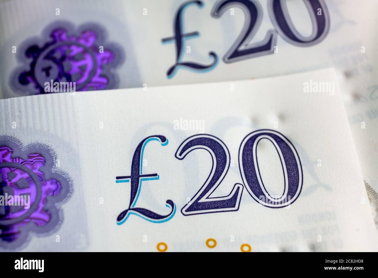 Macro photo of British pound sterling banknotes. Corners of 20 pound ...