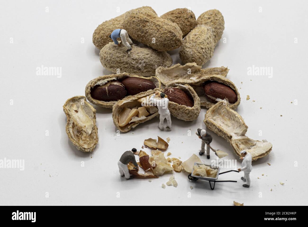 Unique scale model of miniature characters working together to reach a ...