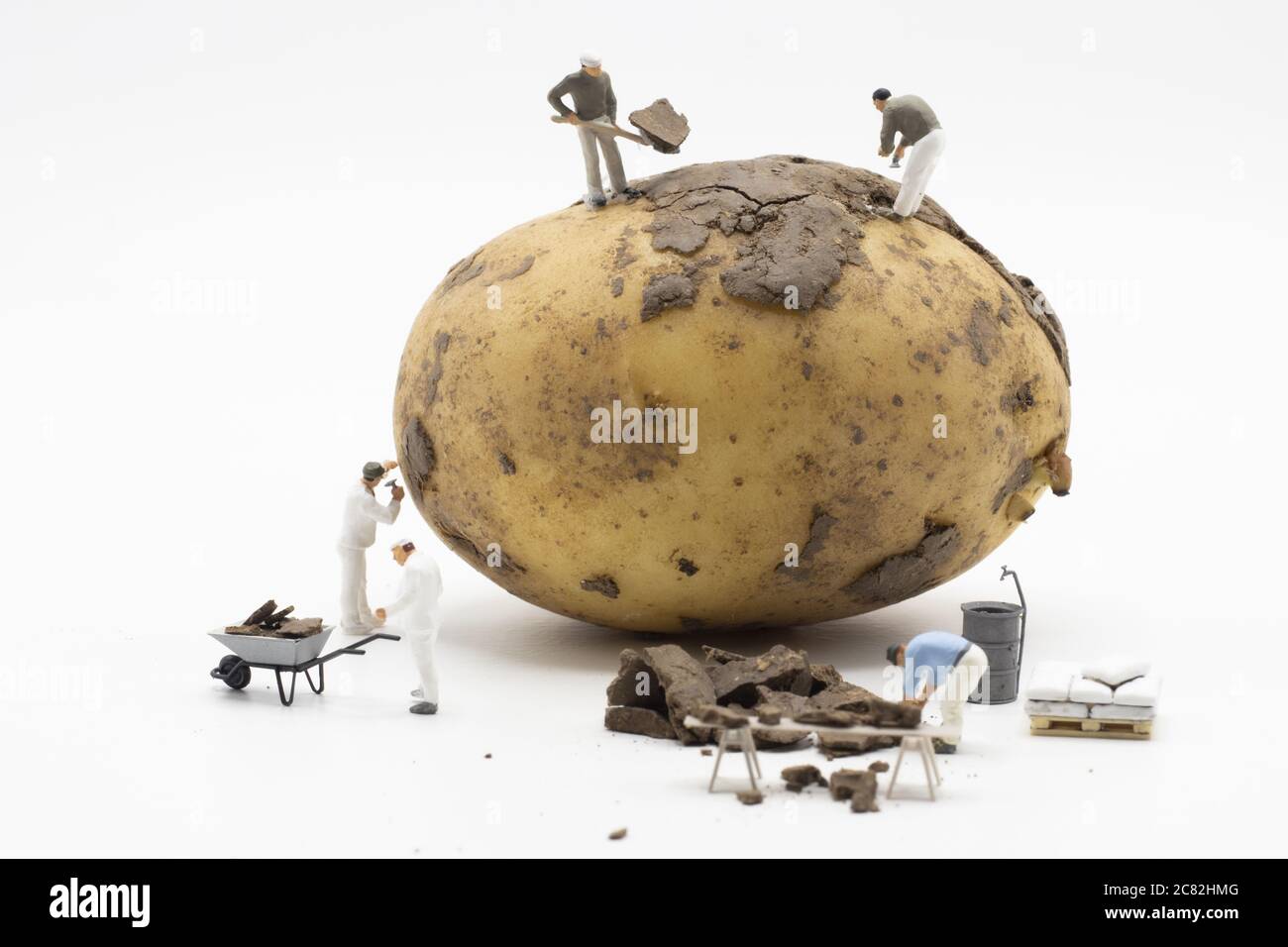 Unique scale model of miniature characters working together to reach a ...