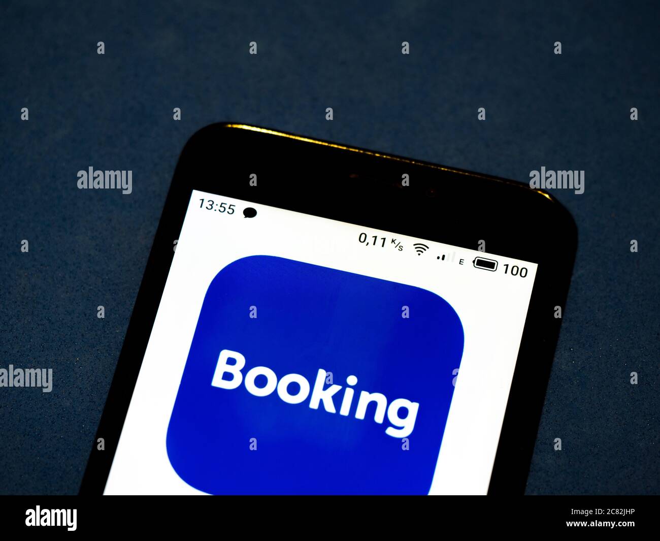 In this photo illustration a Booking logo is seen displayed on a ...