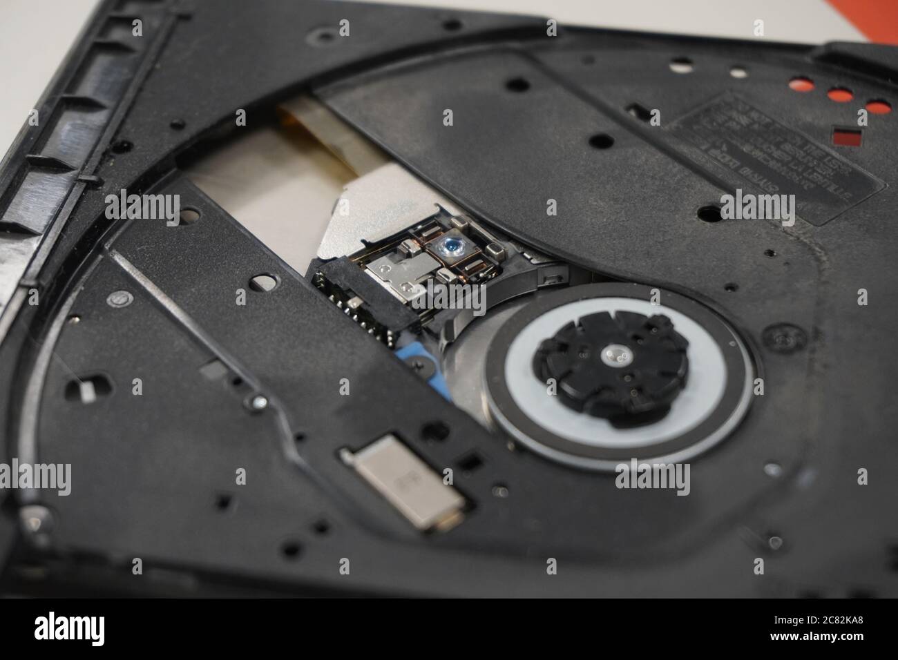 Closeup shot of open optical disc drive on a modern laptop computer ...