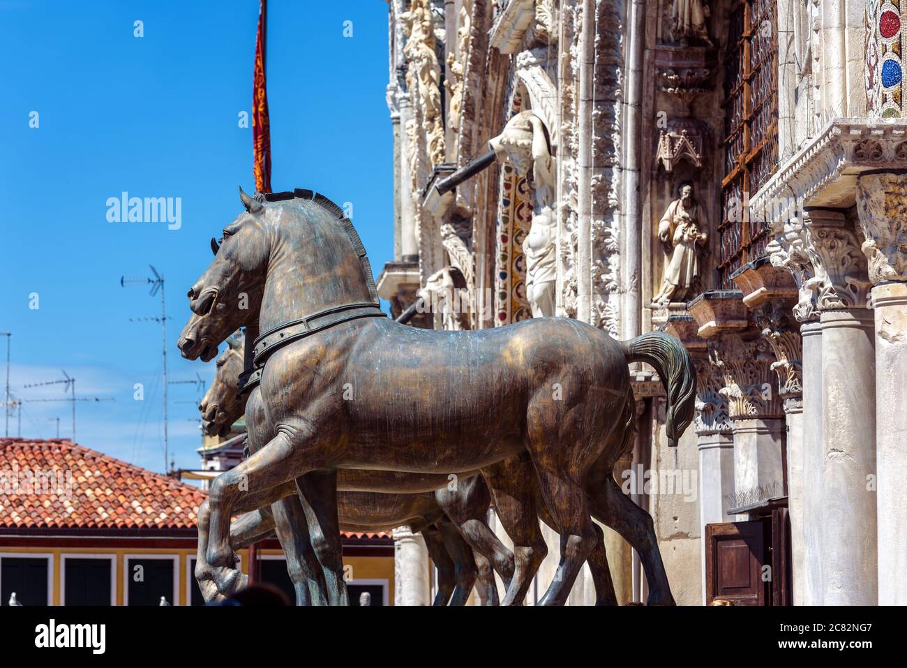 Basilica di San Marco (Saint Mark) detail, ancient bronze horses, Venice, Italy. Old sculpture ...