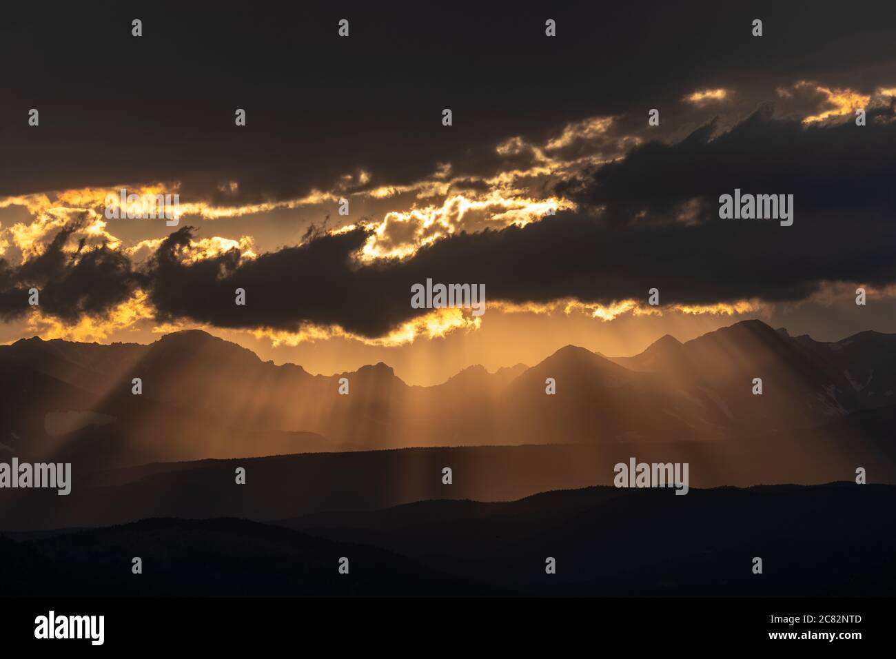 Sun rays over the Rocky Mountains of Colorado Stock Photo - Alamy