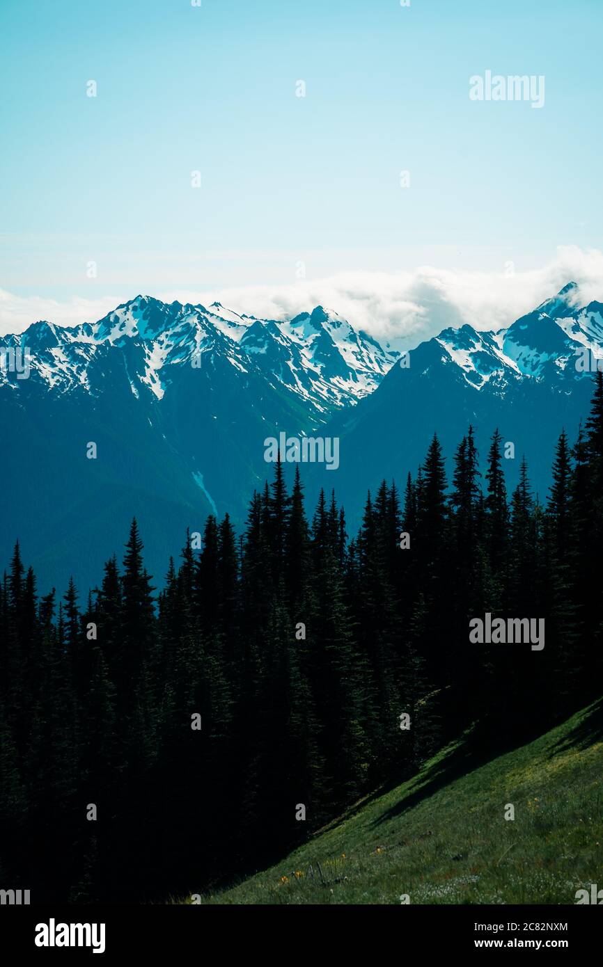 Clouds over olympic mountain range on summer day in Washington Stock ...