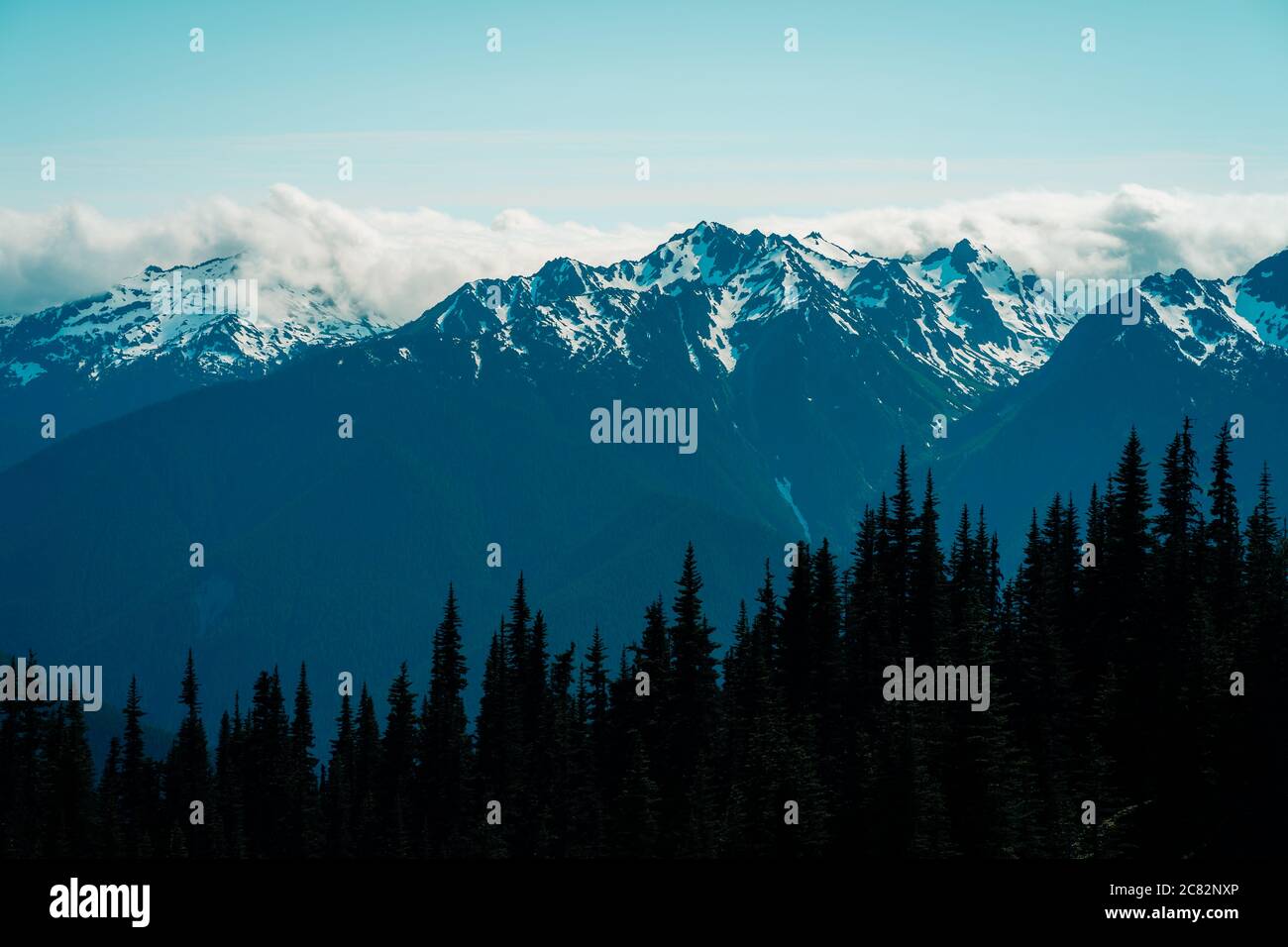 Clouds over olympic mountain range on summer day in Washington Stock ...