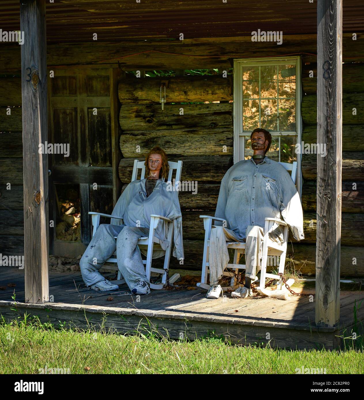 A male and female mannequin head each with stuffed bodies in rocking ...