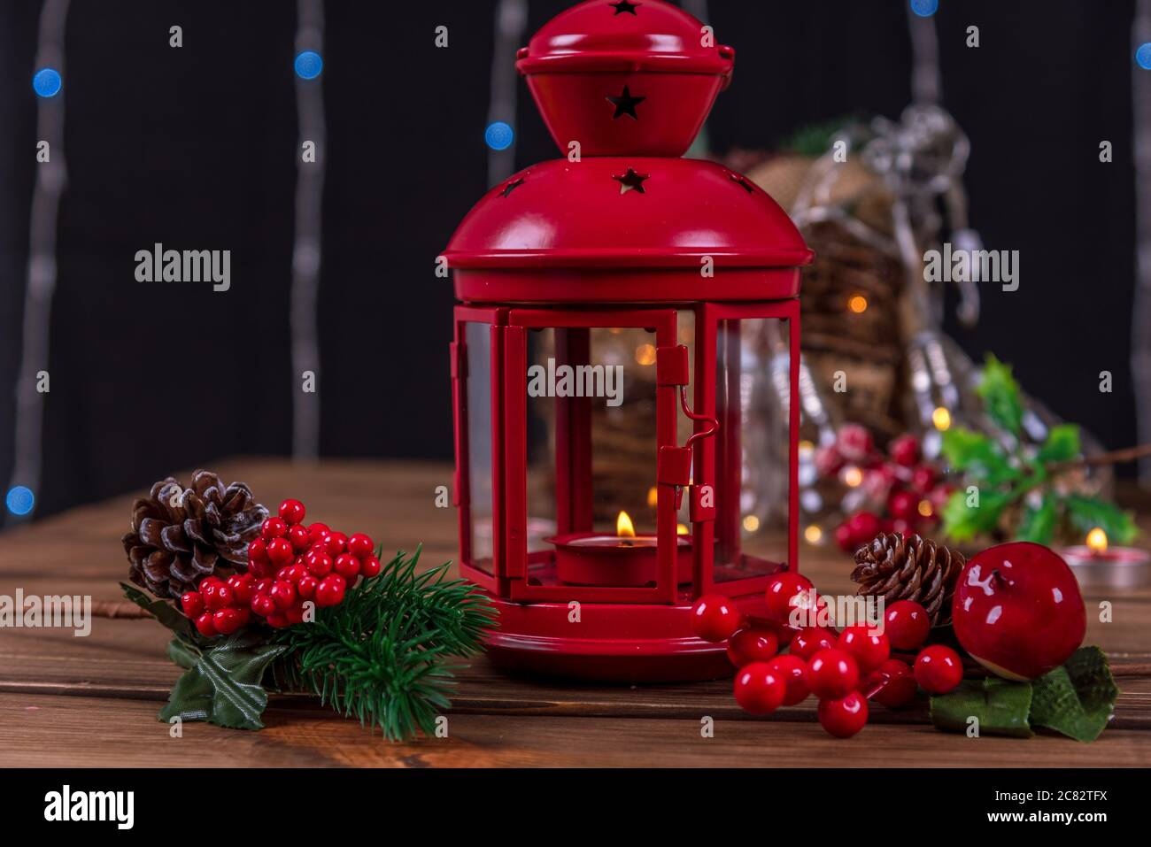 christmas lantern with candle on defocused lights background Stock ...