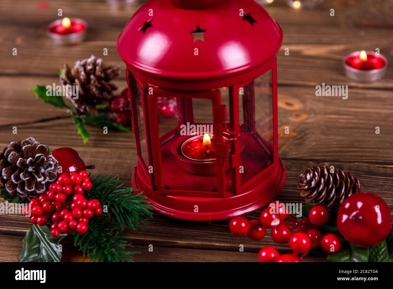christmas lantern with candle on defocused lights background Stock ...