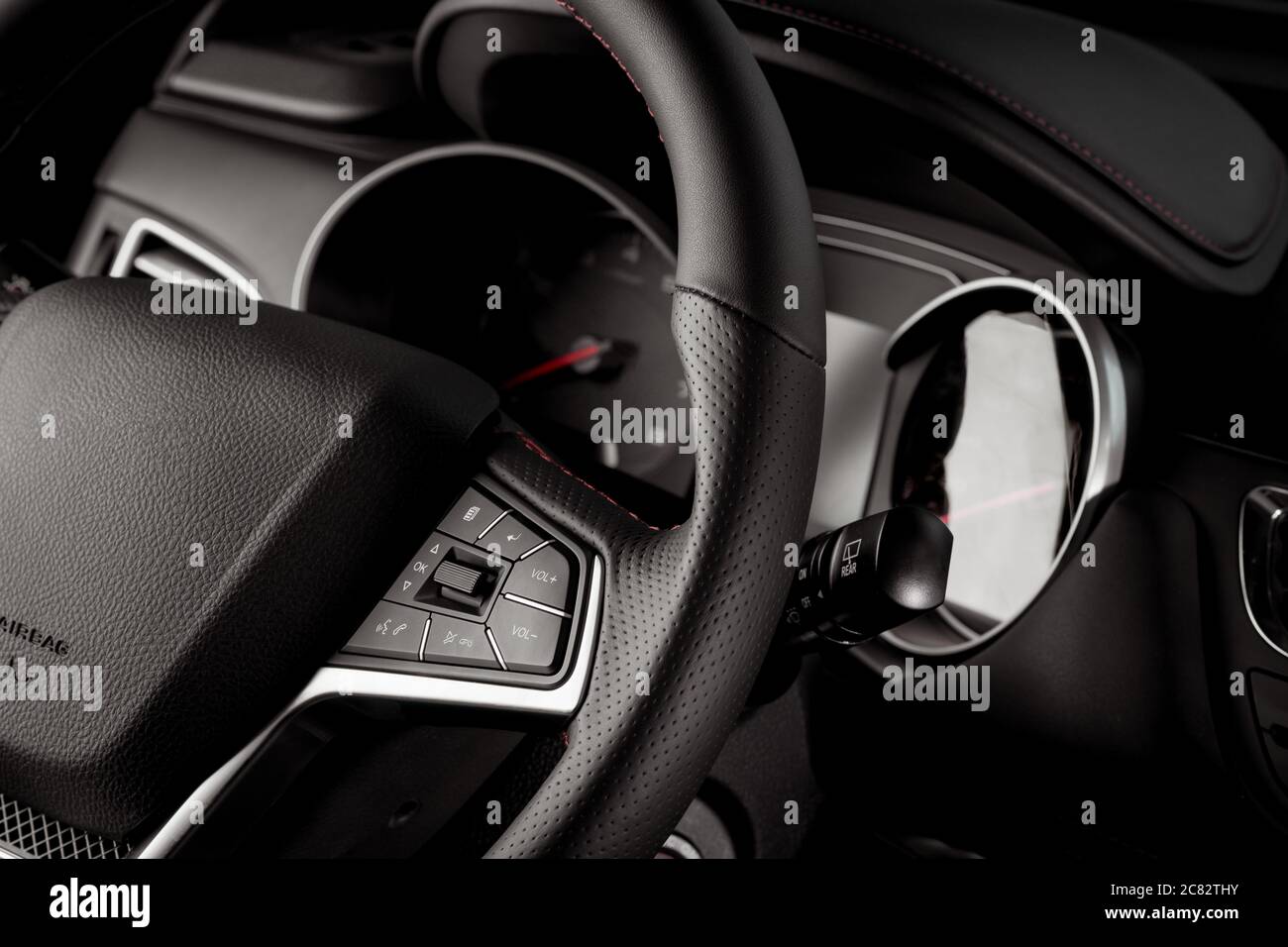 Closeup of the controls on the steering wheel of a new SUV Stock Photo ...