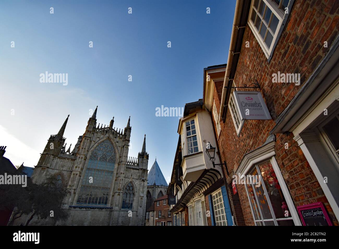 The eastern end of York Minster seen from College Street. Old fashioned ...