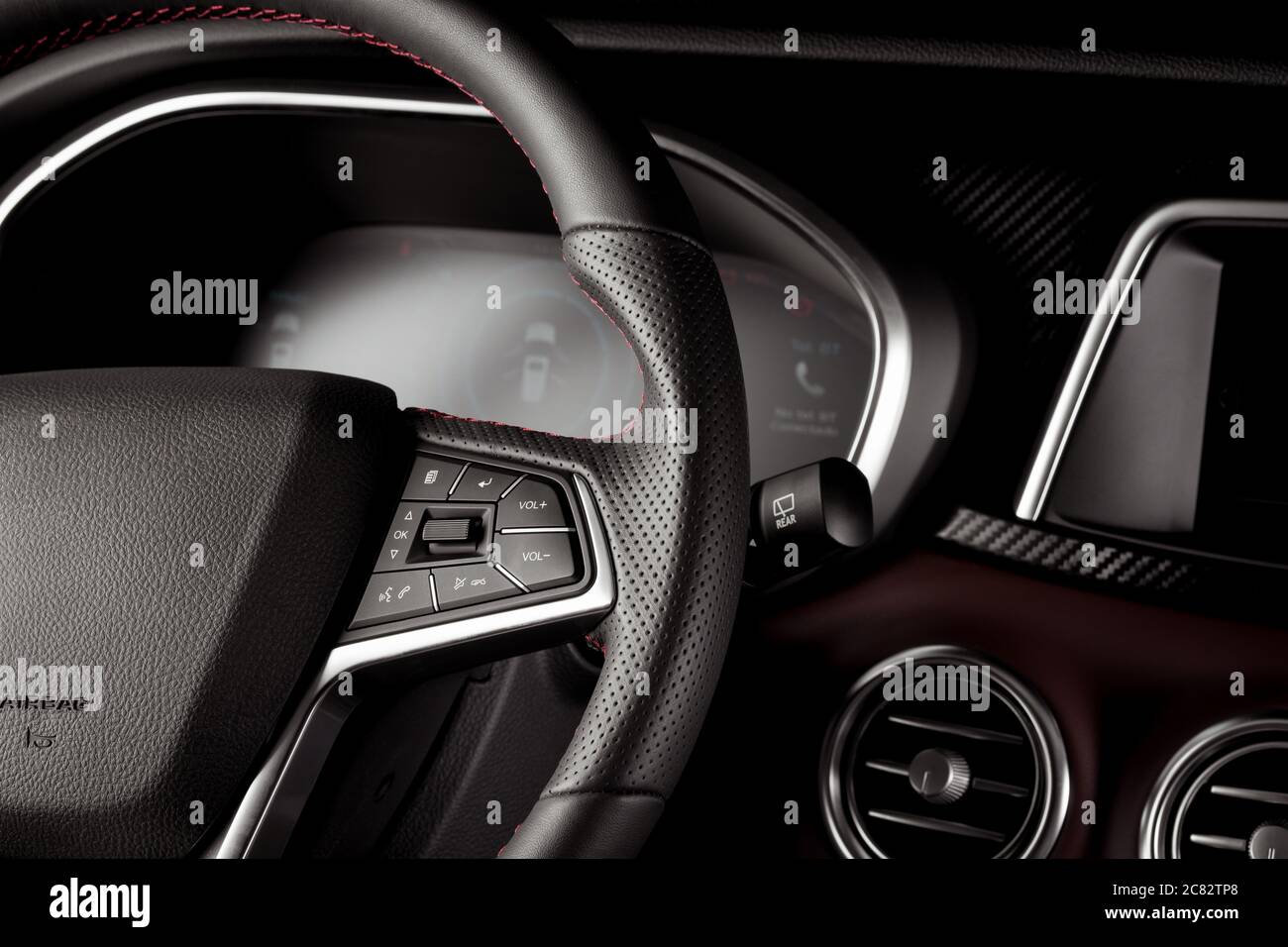 Closeup of the controls on the steering wheel of a new SUV Stock Photo ...