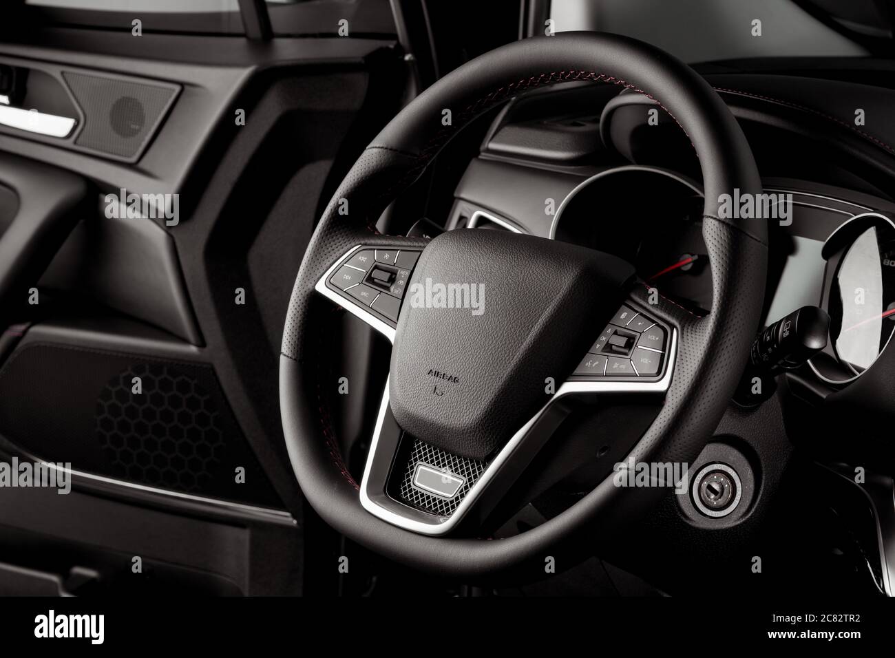 Leather-covered steering wheel of a new SUV Stock Photo - Alamy