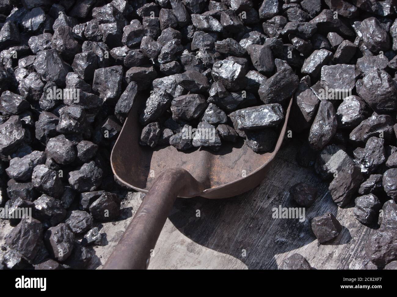 Coal and shovel ready to be burned Stock Photo - Alamy