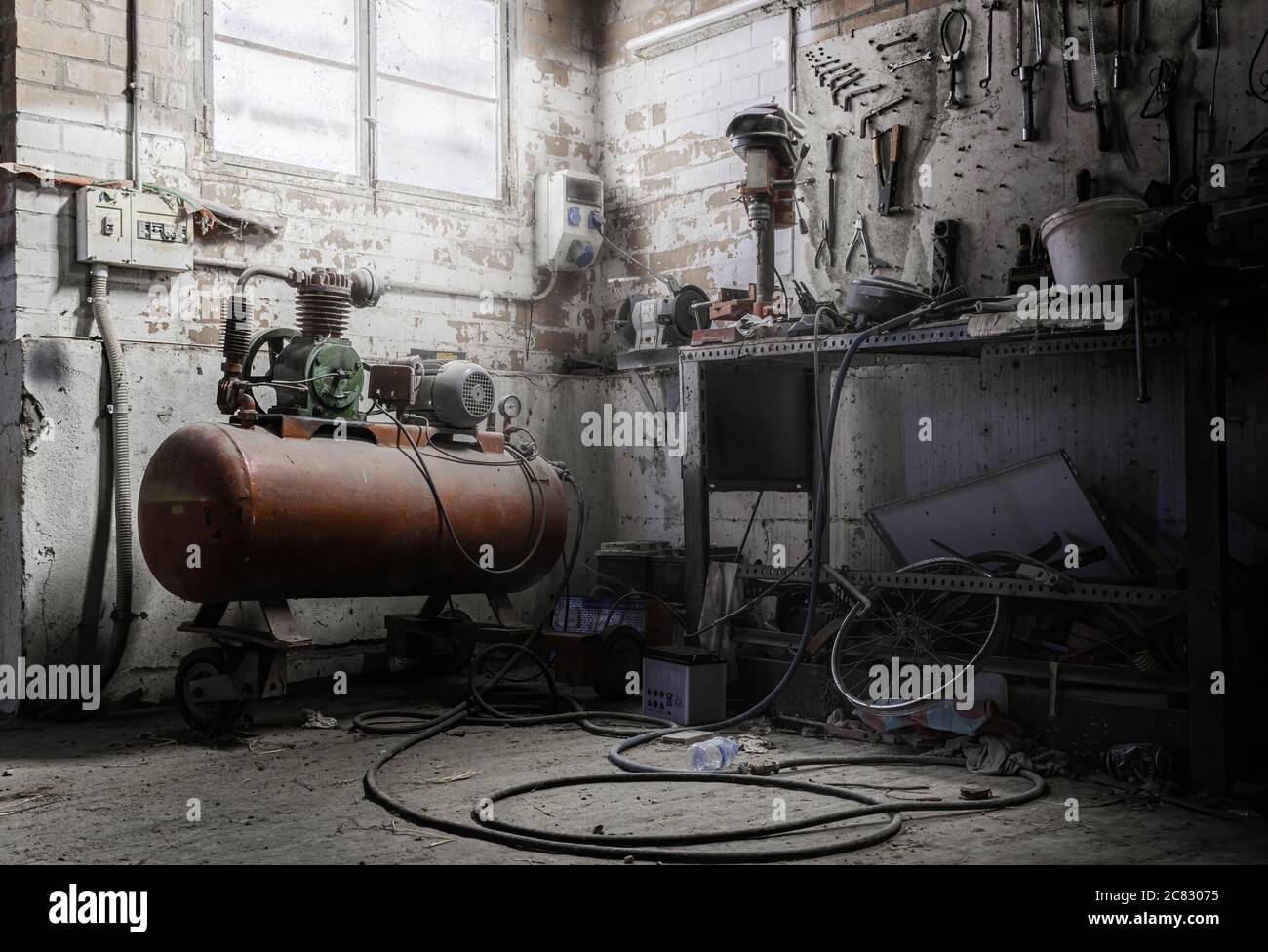 Red gas compressor in an abandoned building Stock Photo - Alamy