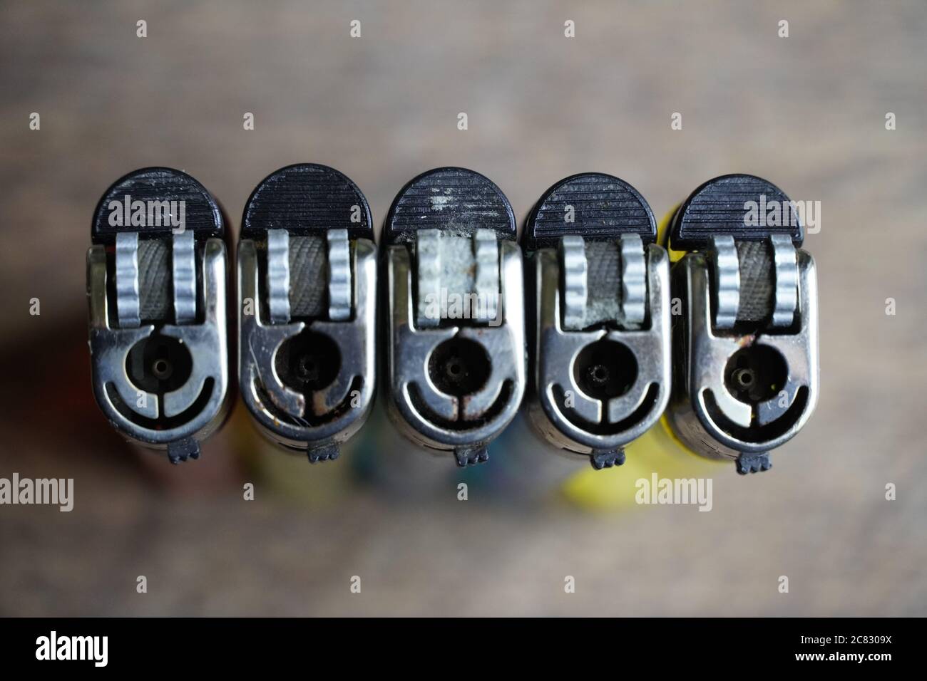 Lighters next to each other on the table Stock Photo - Alamy