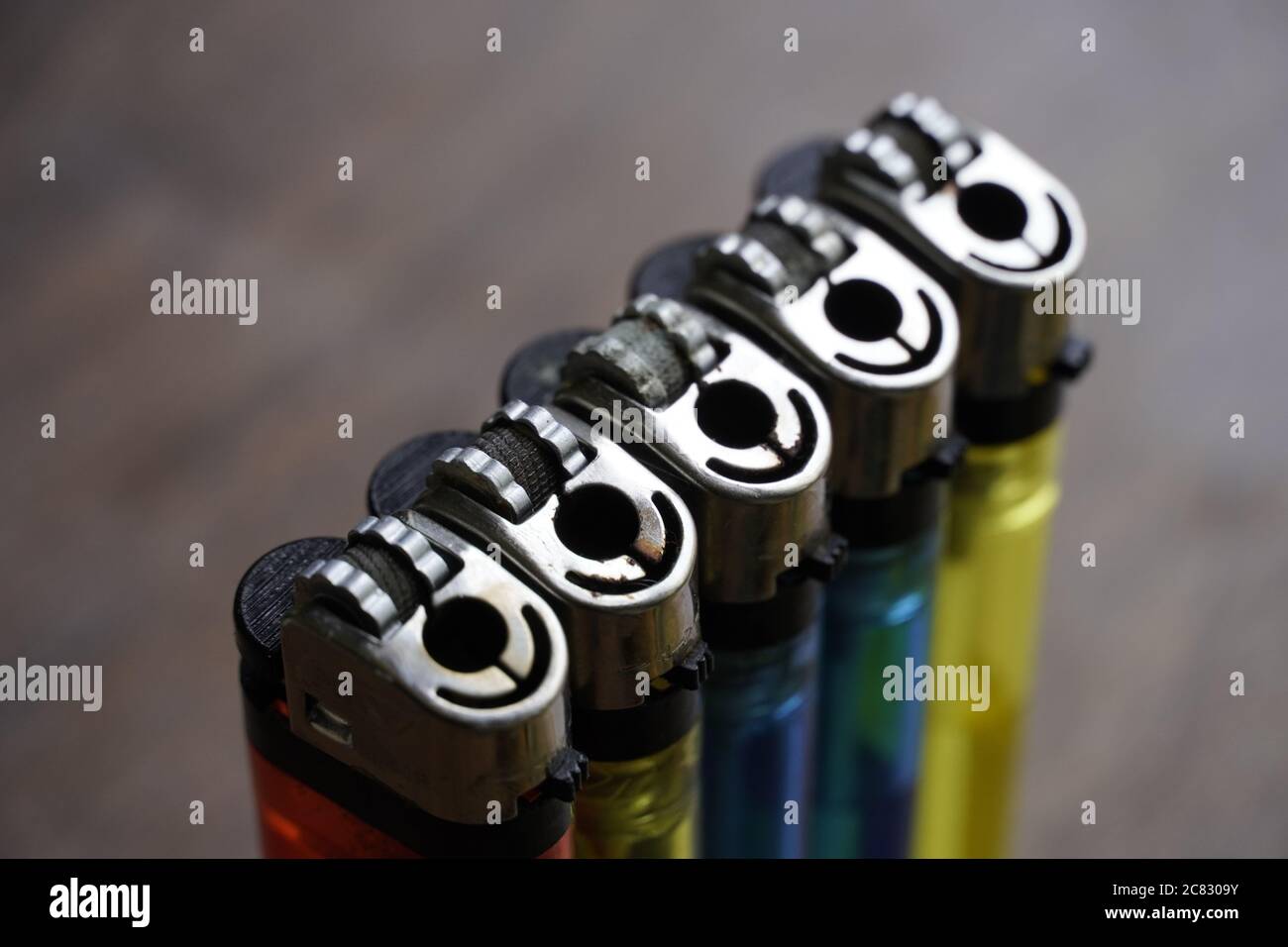 Lighters next to each other on the table Stock Photo - Alamy