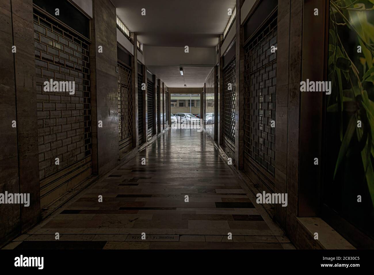 Dark hallway that leads to the street - concept: mysterious, scary ...