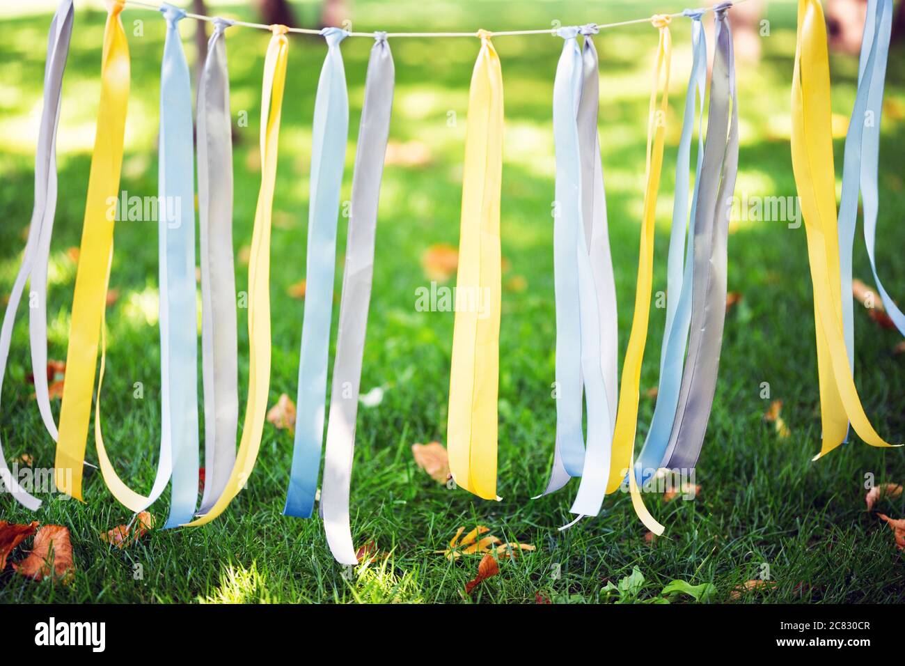 colorful party ribbon on outdoors. Fun summer. birthday on the lawn ...