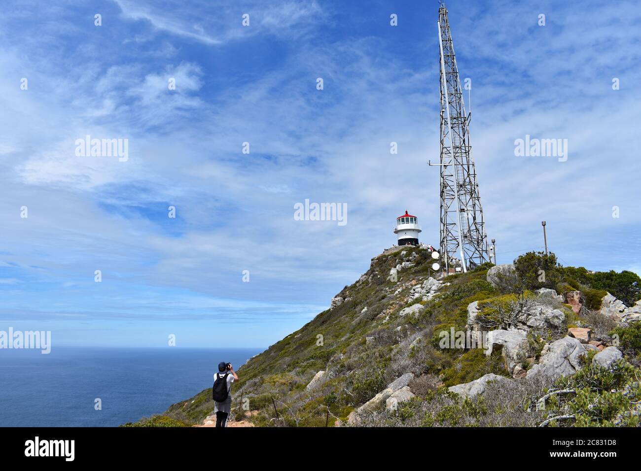 A visitor takes a picture of the Old Lighthouse at Cape Point . The ...