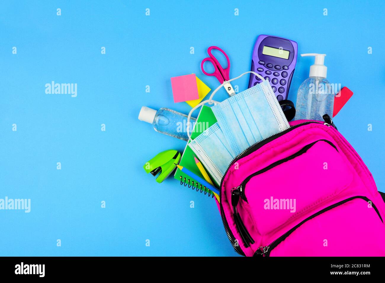 Backpack full of school supplies and COVID 19 prevention items. Top ...