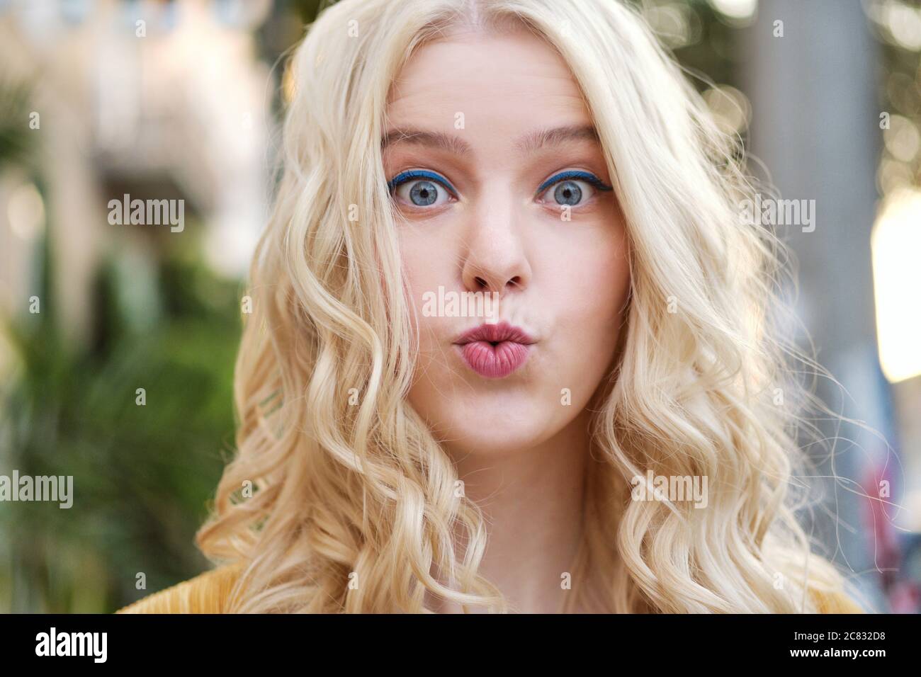 Woman blowing cheeks hi-res stock photography and images - Alamy