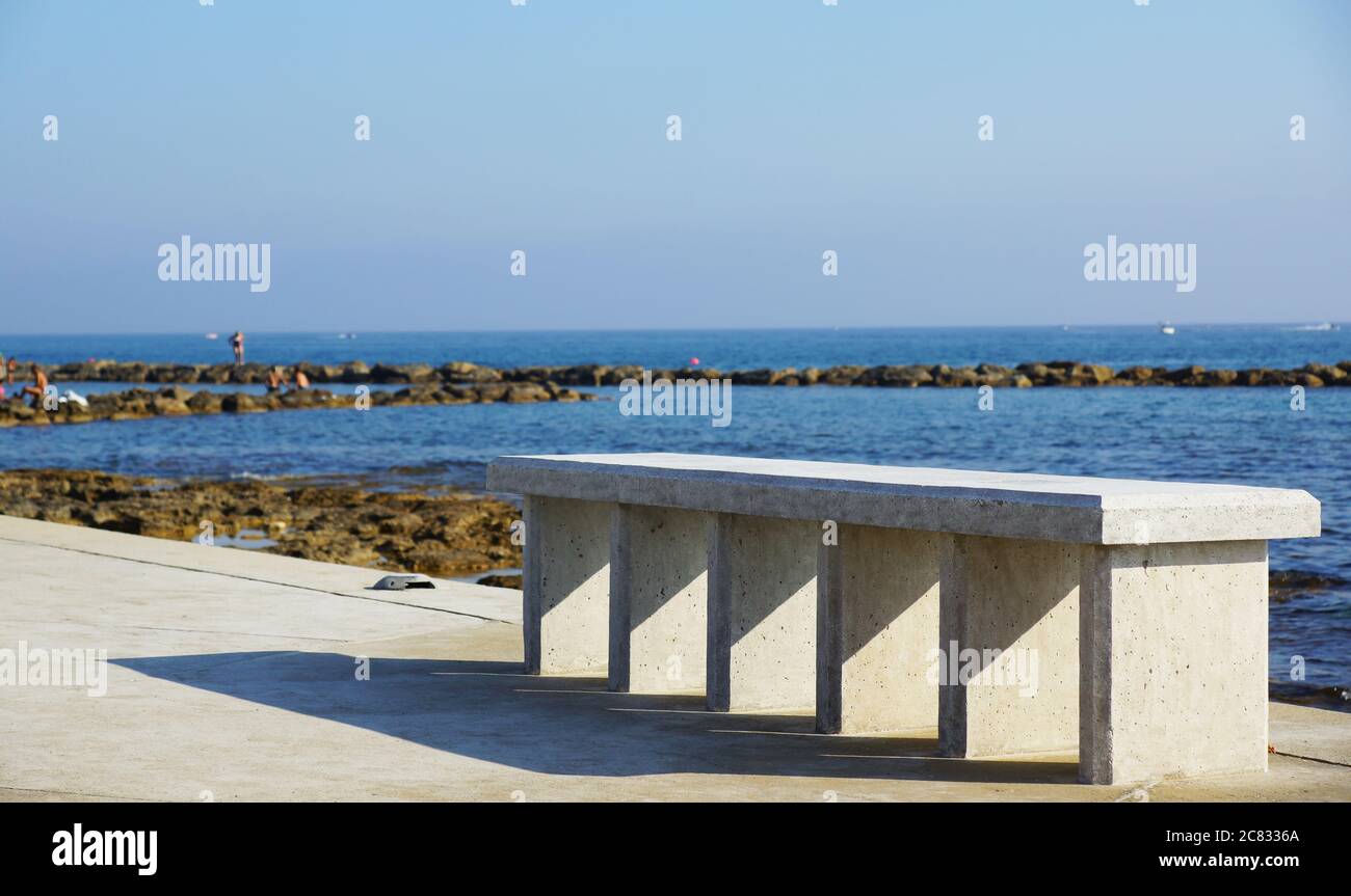 Stone bench by the coast Stock Photo - Alamy
