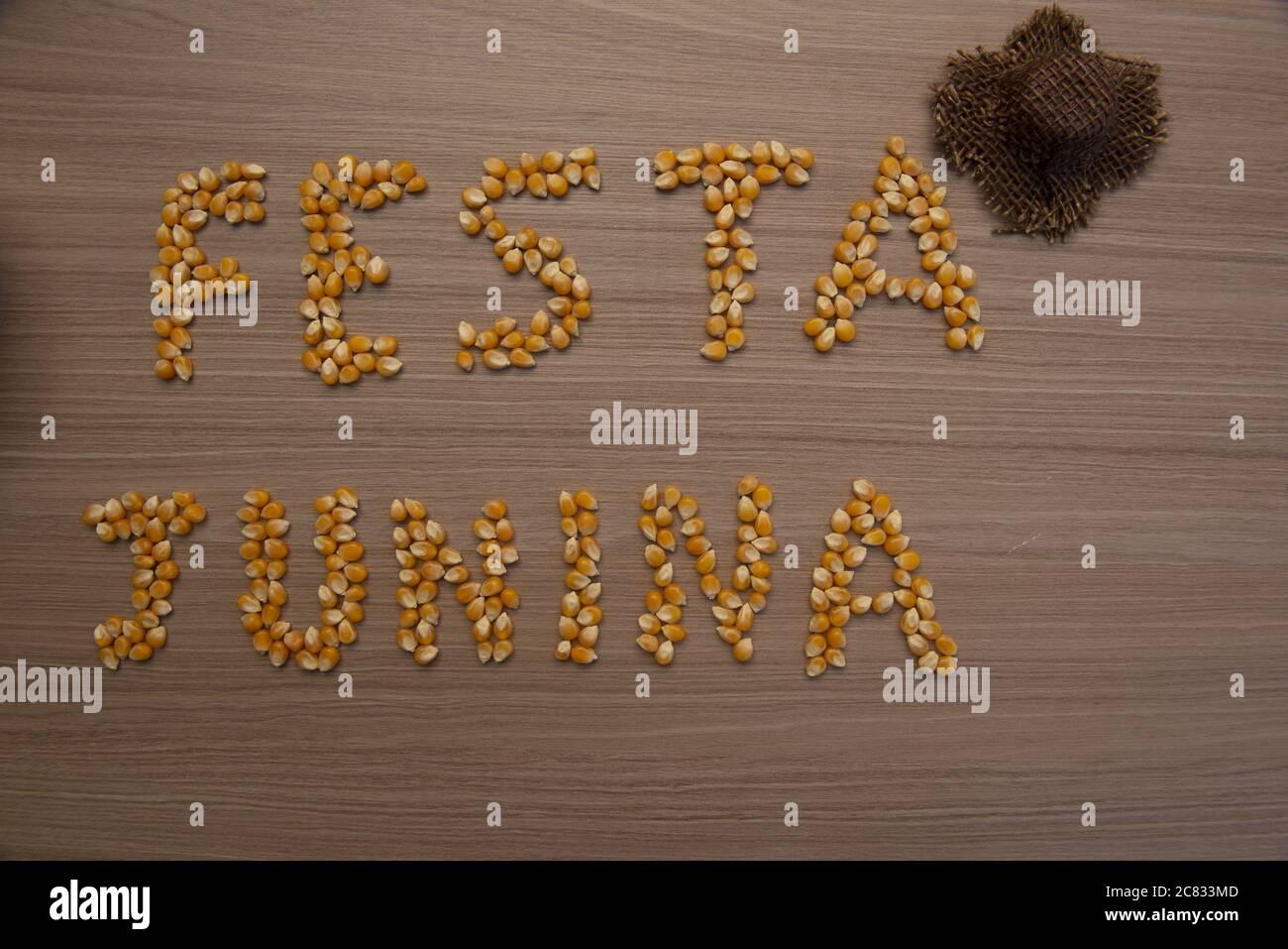 Festa Junina written with corn grains on wood table Stock Photo - Alamy