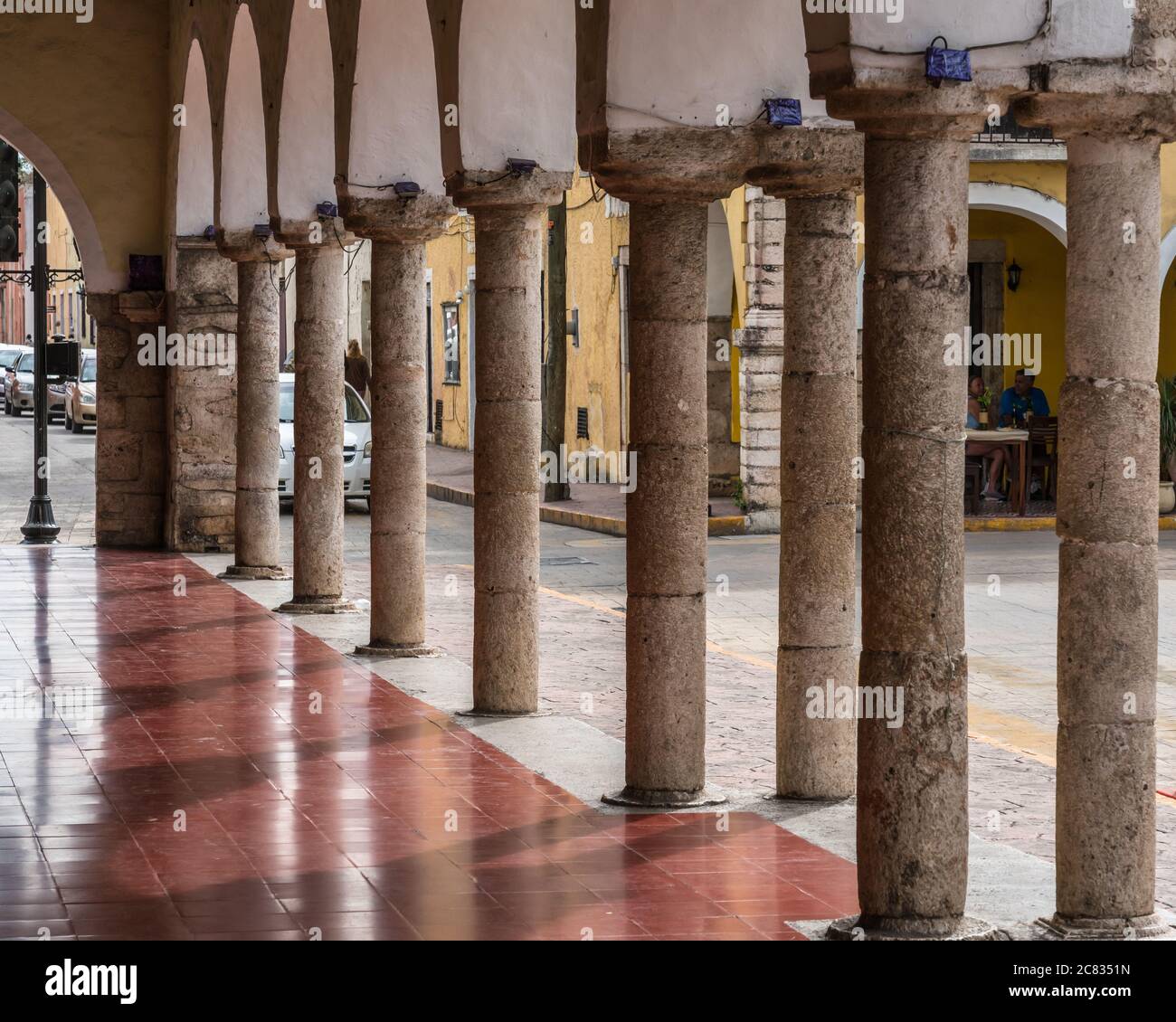 The stone columns and arcade of the Municipal Palace or city hall in ...