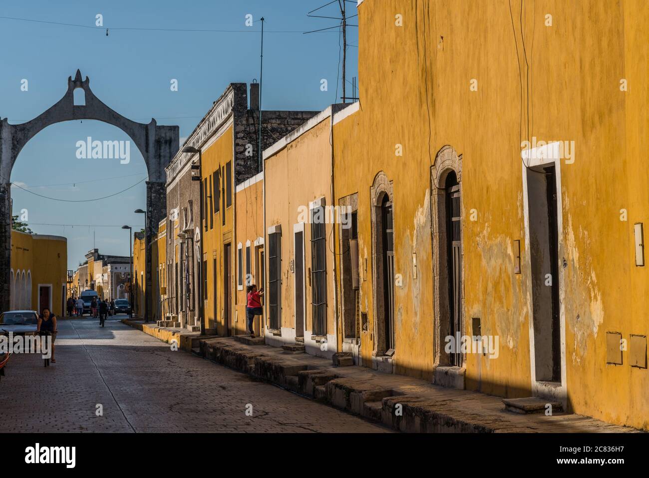 Yellow buildings and the gate in Izamal, Yucatan, Mexico, known as the ...