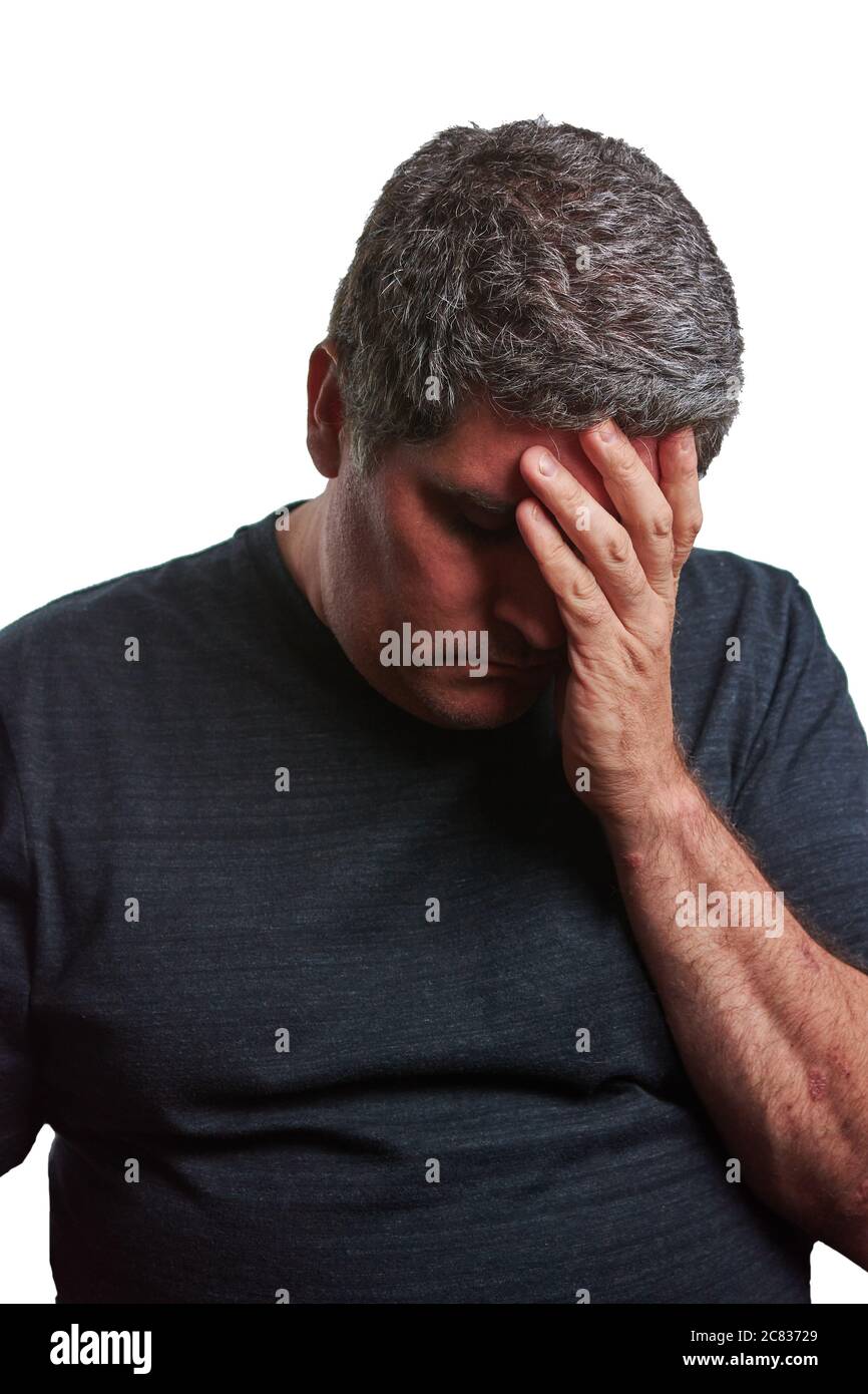 Man with one hand on his head defeated with a black T-shirt on a white ...