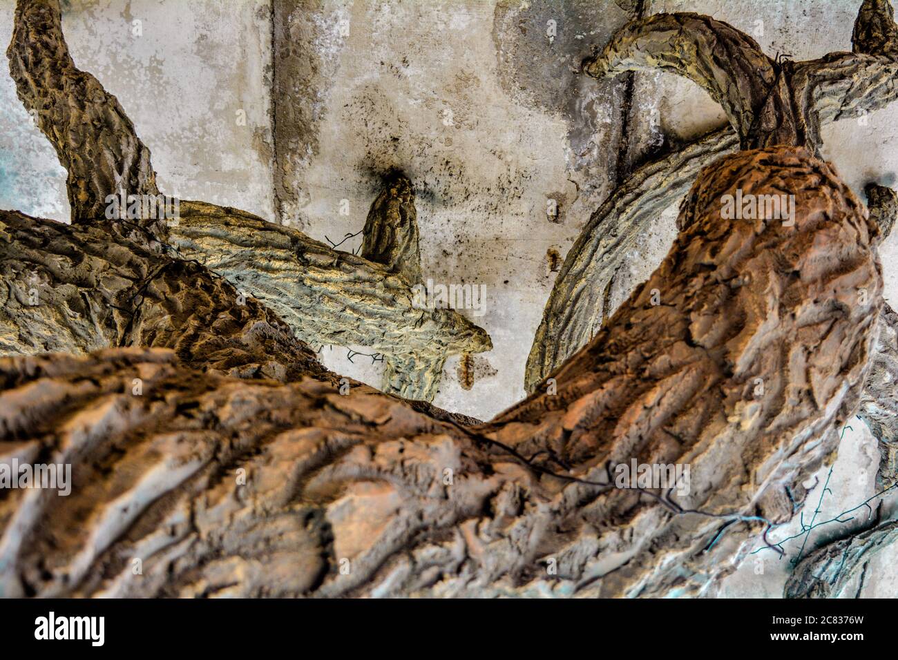 Clumsy artificial tree supports roof like decorative pillar ...