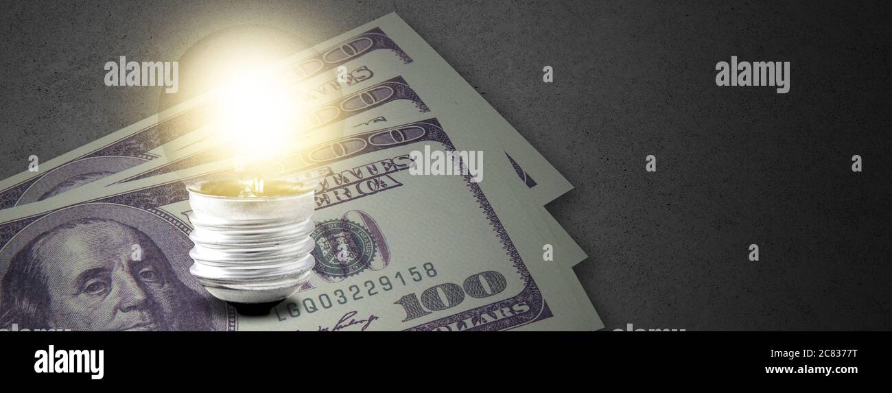 Lightbulb on money dollar currency, financial and profit of economic ...