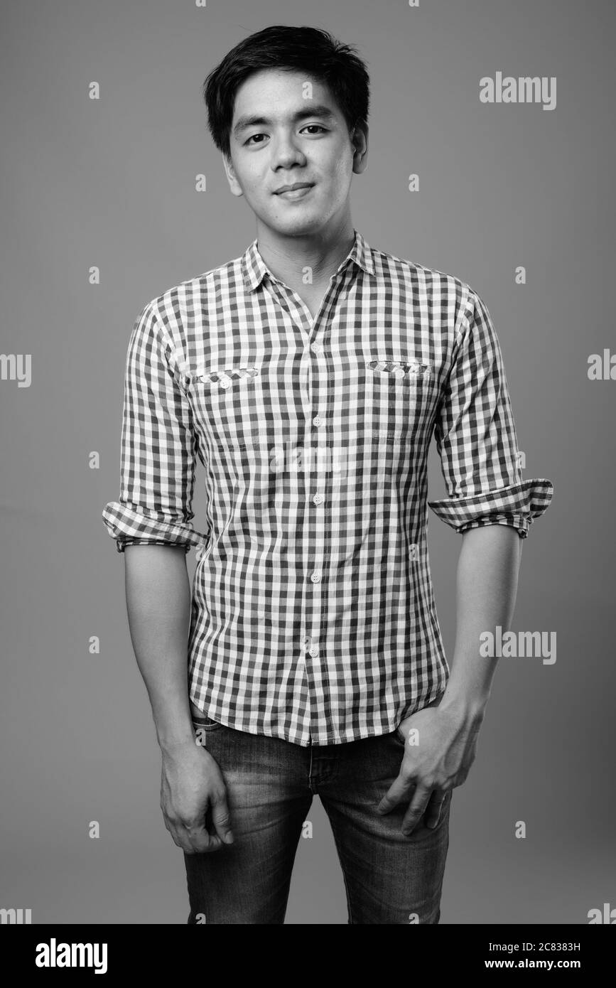 Portrait of young handsome Filipino hipster man Stock Photo - Alamy