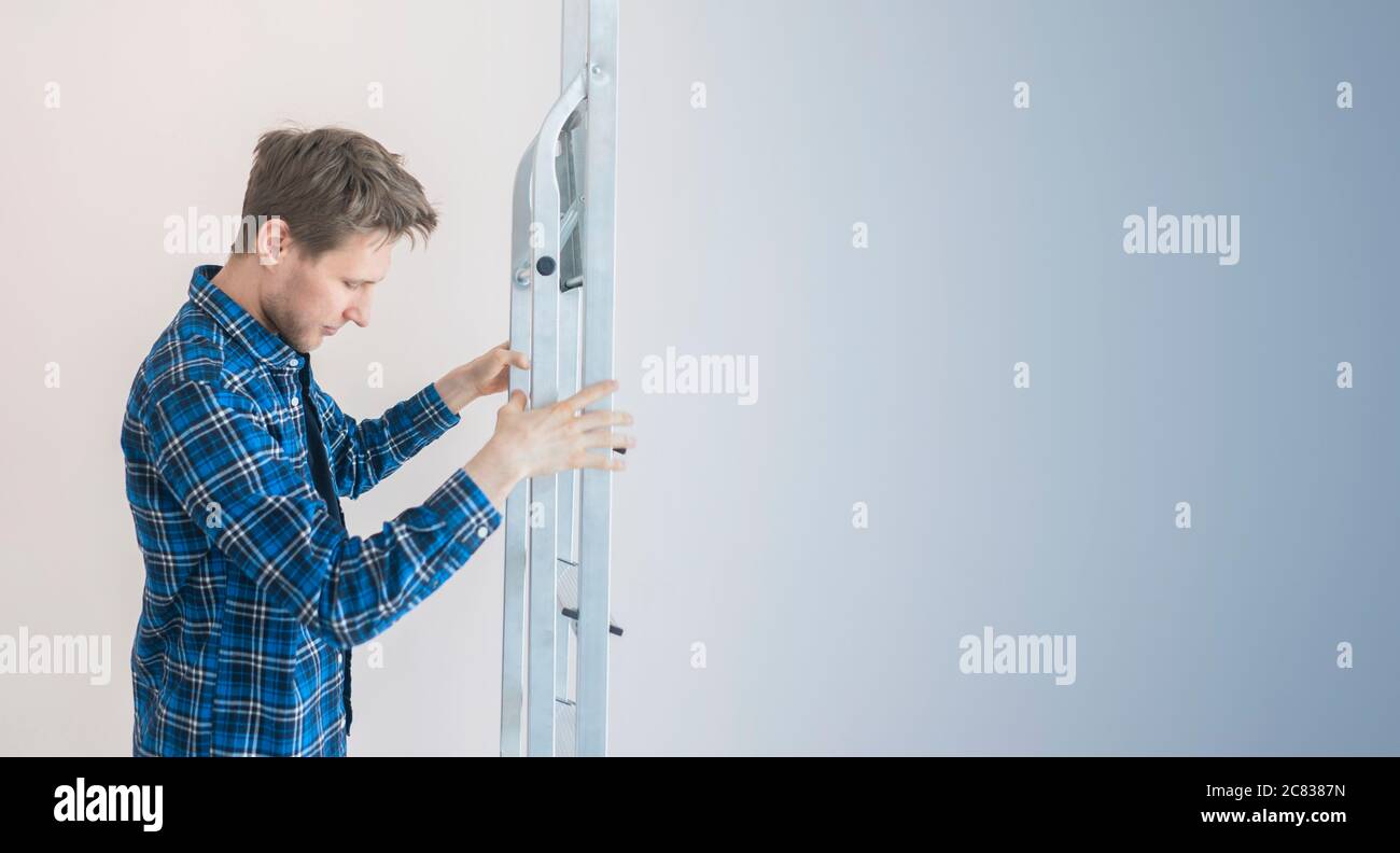 Construction worker holding ladder hi-res stock photography and images ...