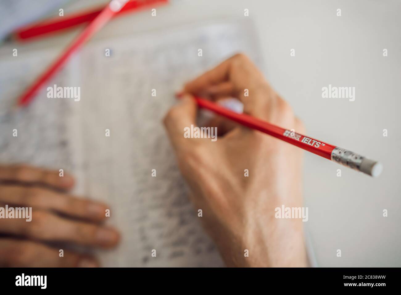 Vietnam, Nha Trang, 14.07.2020: IELTS red pencils and essay notebook ...