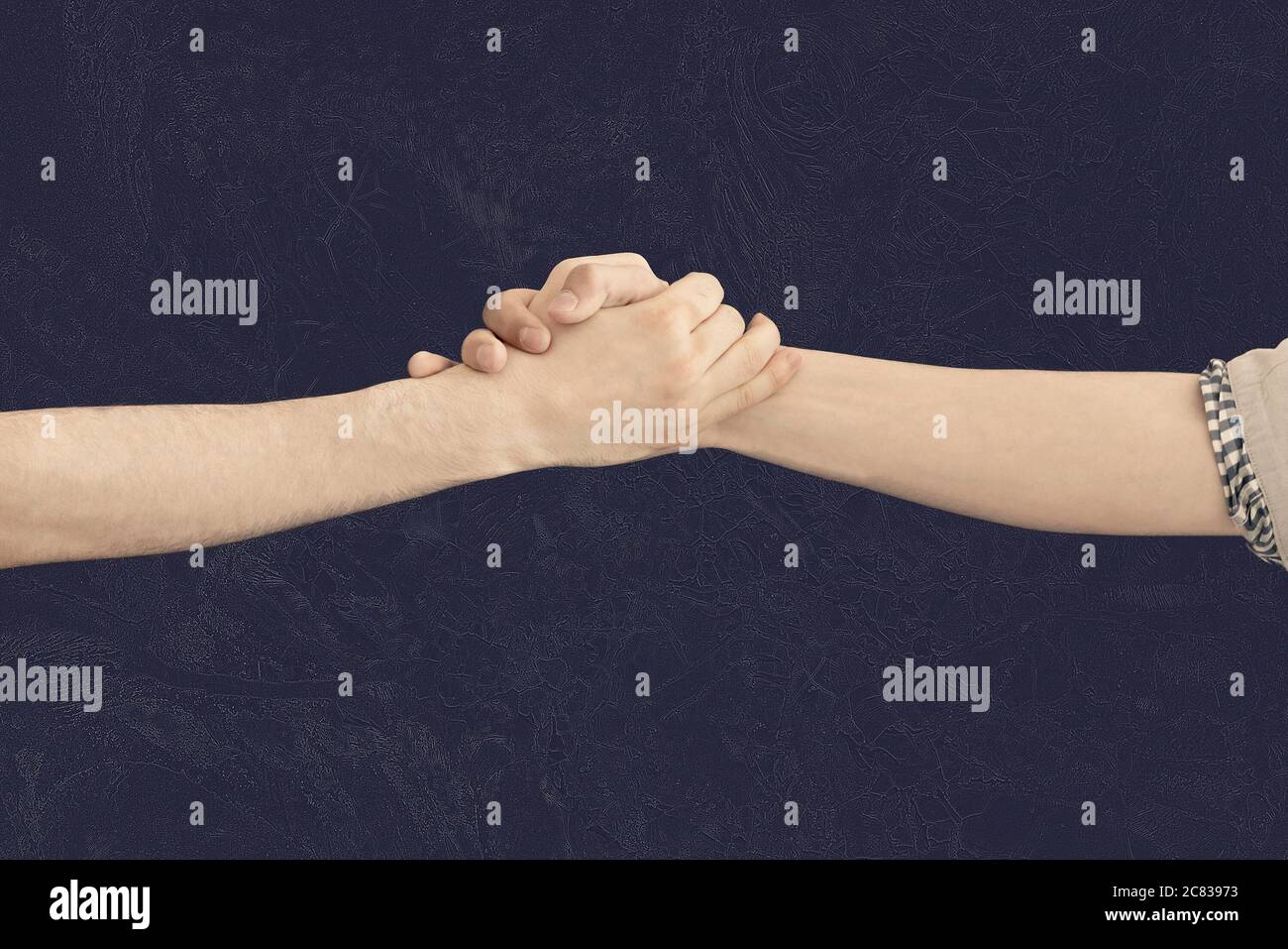 the two hands support each other, handshake, isolated against the ...