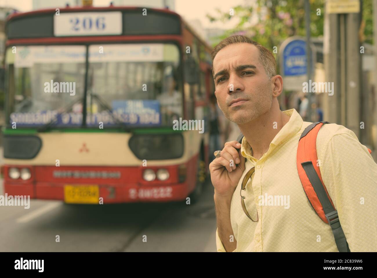 Handsome Persian tourist man exploring the city Stock Photo - Alamy
