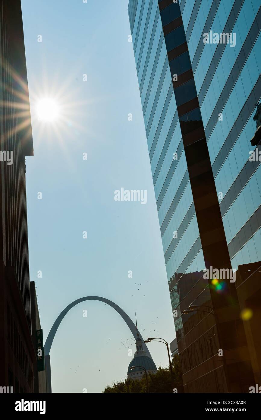 St Louis Gateway Arch at end of city street framed by high-rise ...